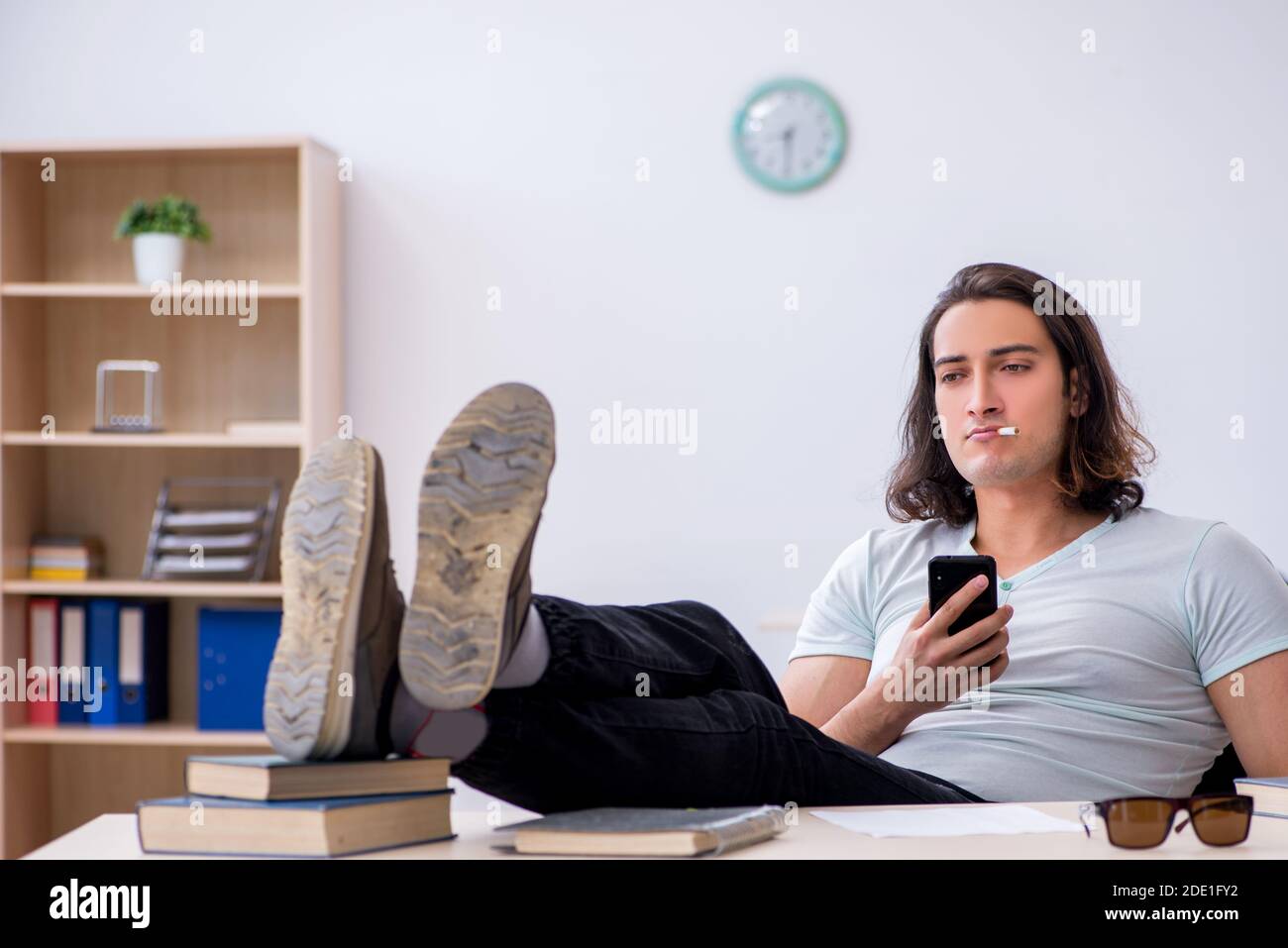 Male student smoking cigarettes in the classroom Stock Photo - Alamy