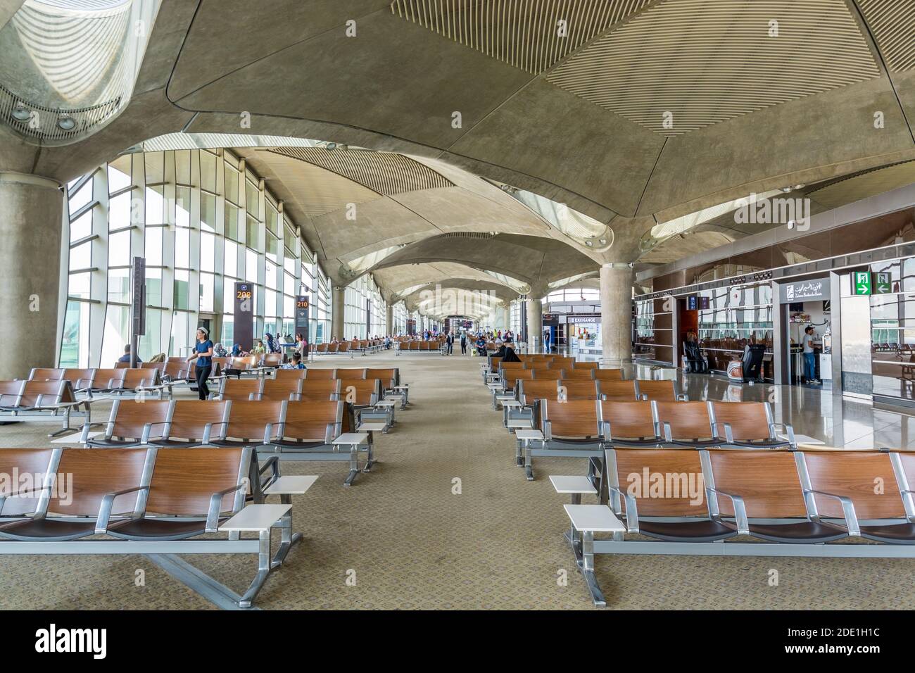 Interiors of boarding gate with a lots of chairs in Queen Alia ...