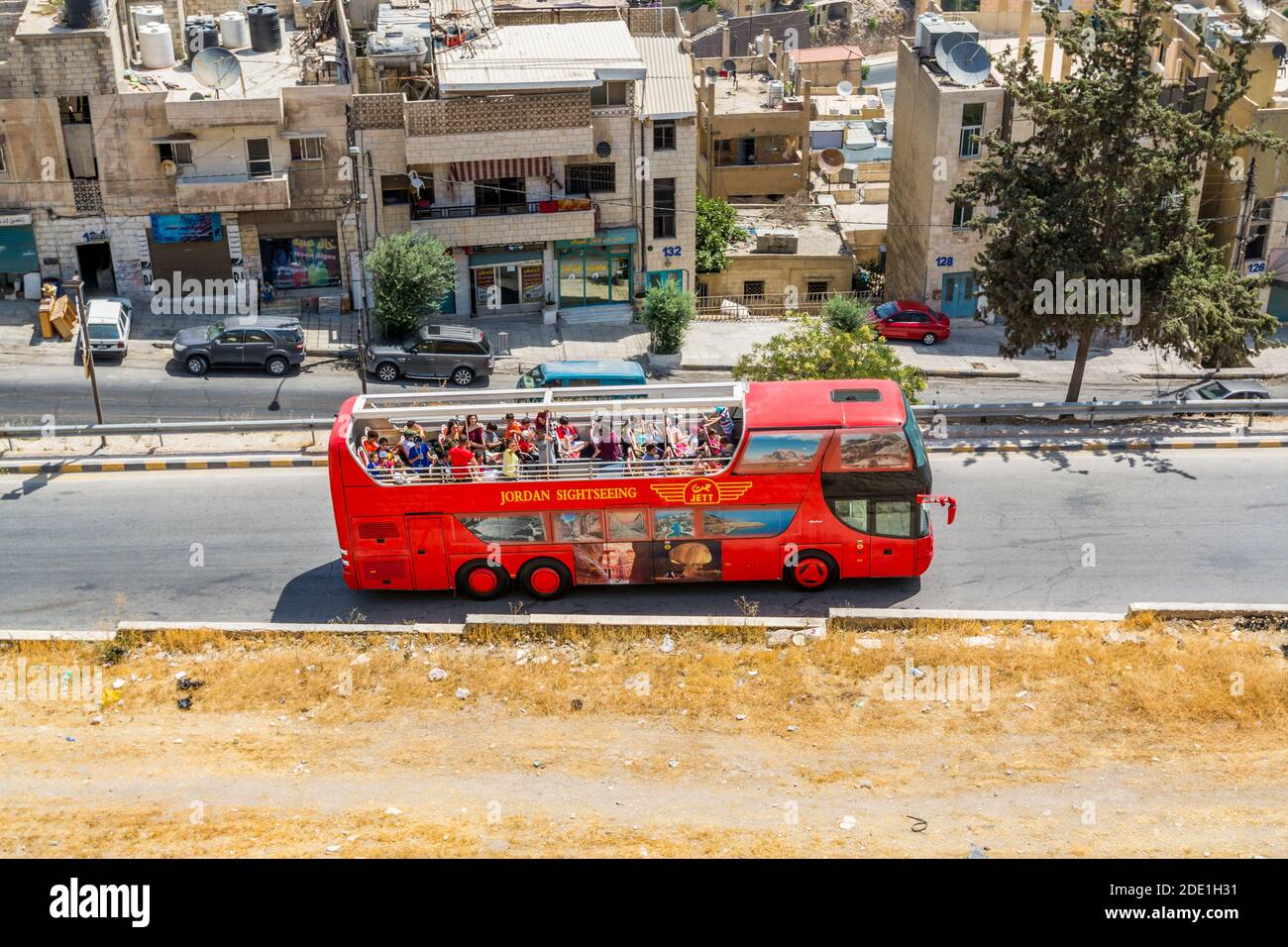 A traveling double-decker bus with full of tourists heading to Amman ...