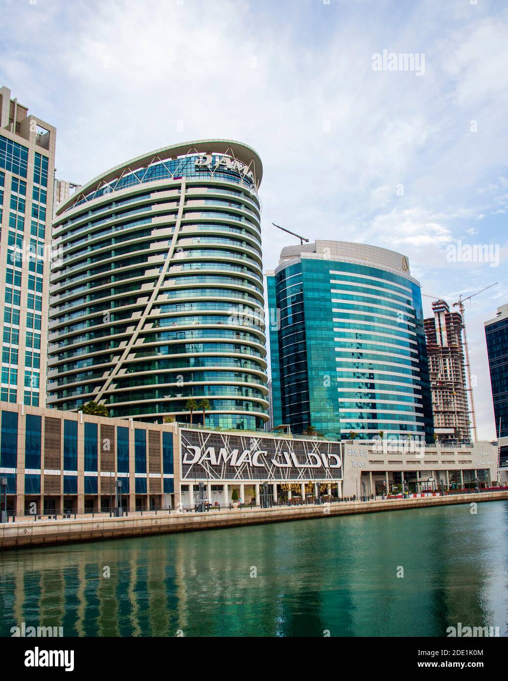 Modern buildings along the Dubai water canal, business bay district ...