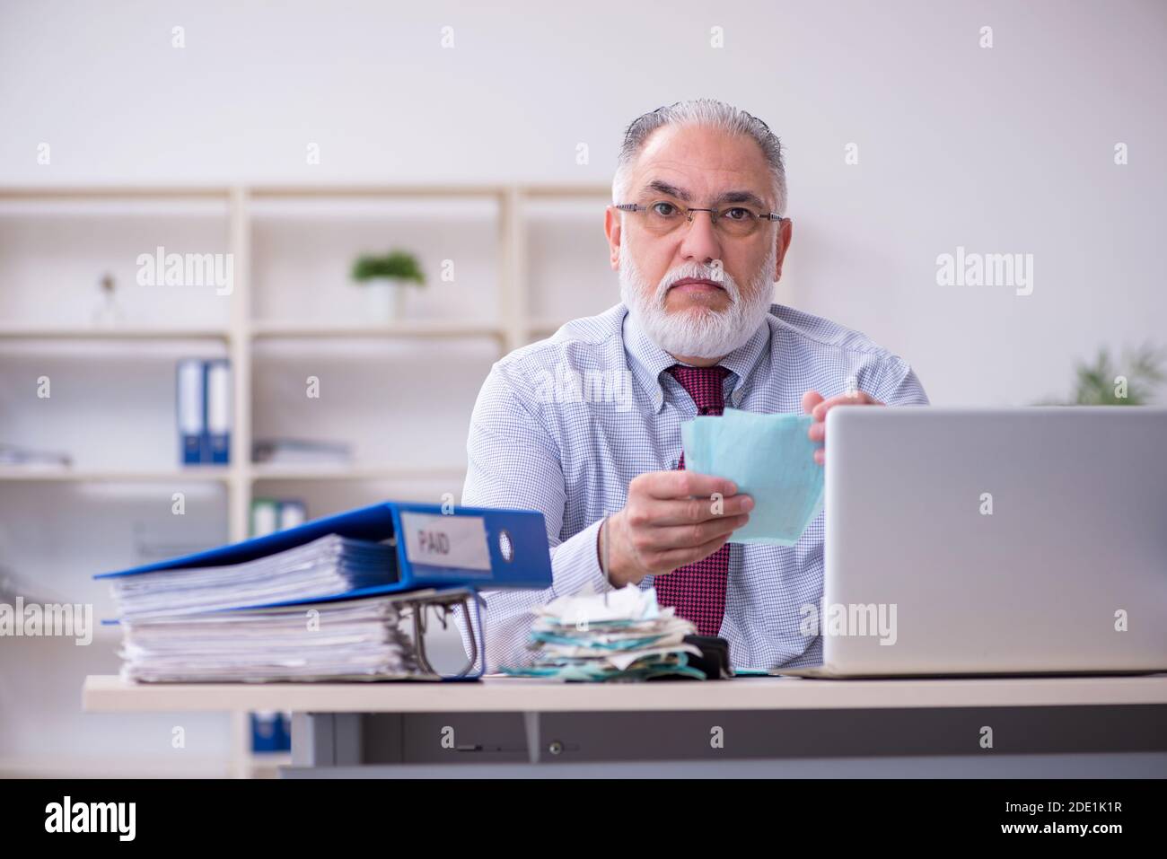 Senior accountant in budget planning concept in the office Stock Photo ...