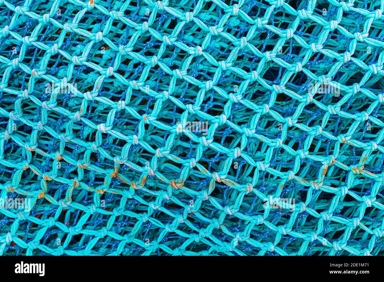 turquoise blue fishing net Stock Photo - Alamy