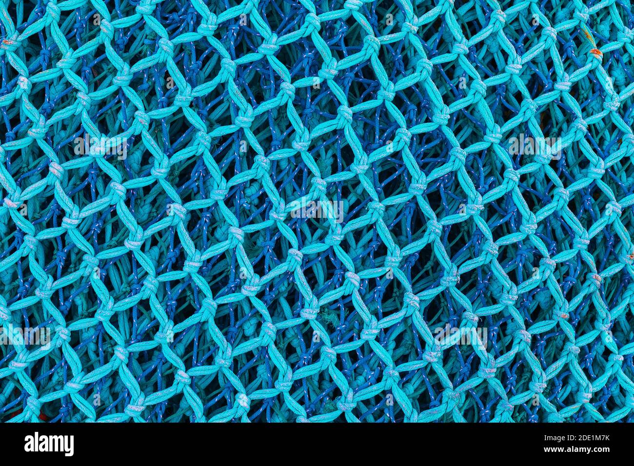 turquoise blue fishing net Stock Photo - Alamy