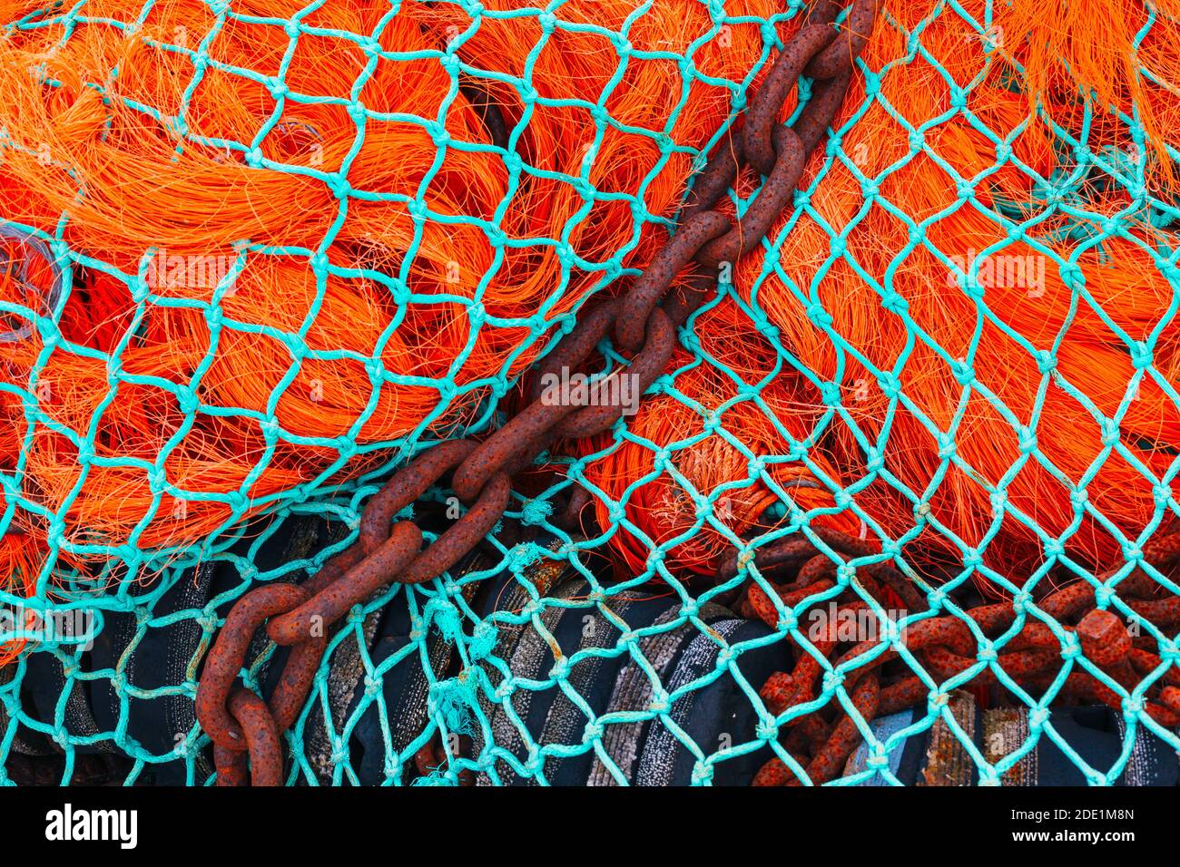 turquoise blue and orange fishing net Stock Photo - Alamy