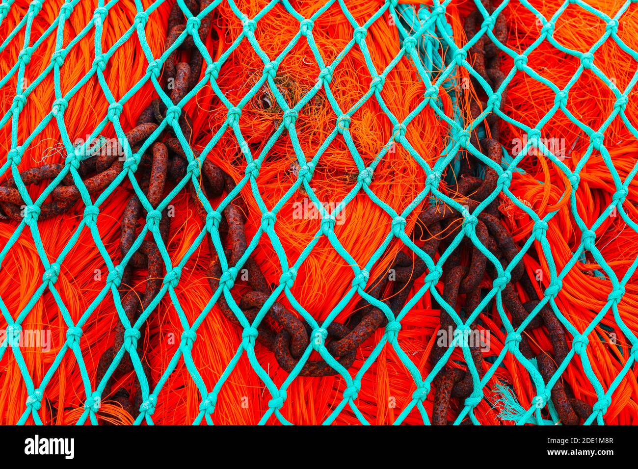 turquoise blue and orange fishing net Stock Photo - Alamy