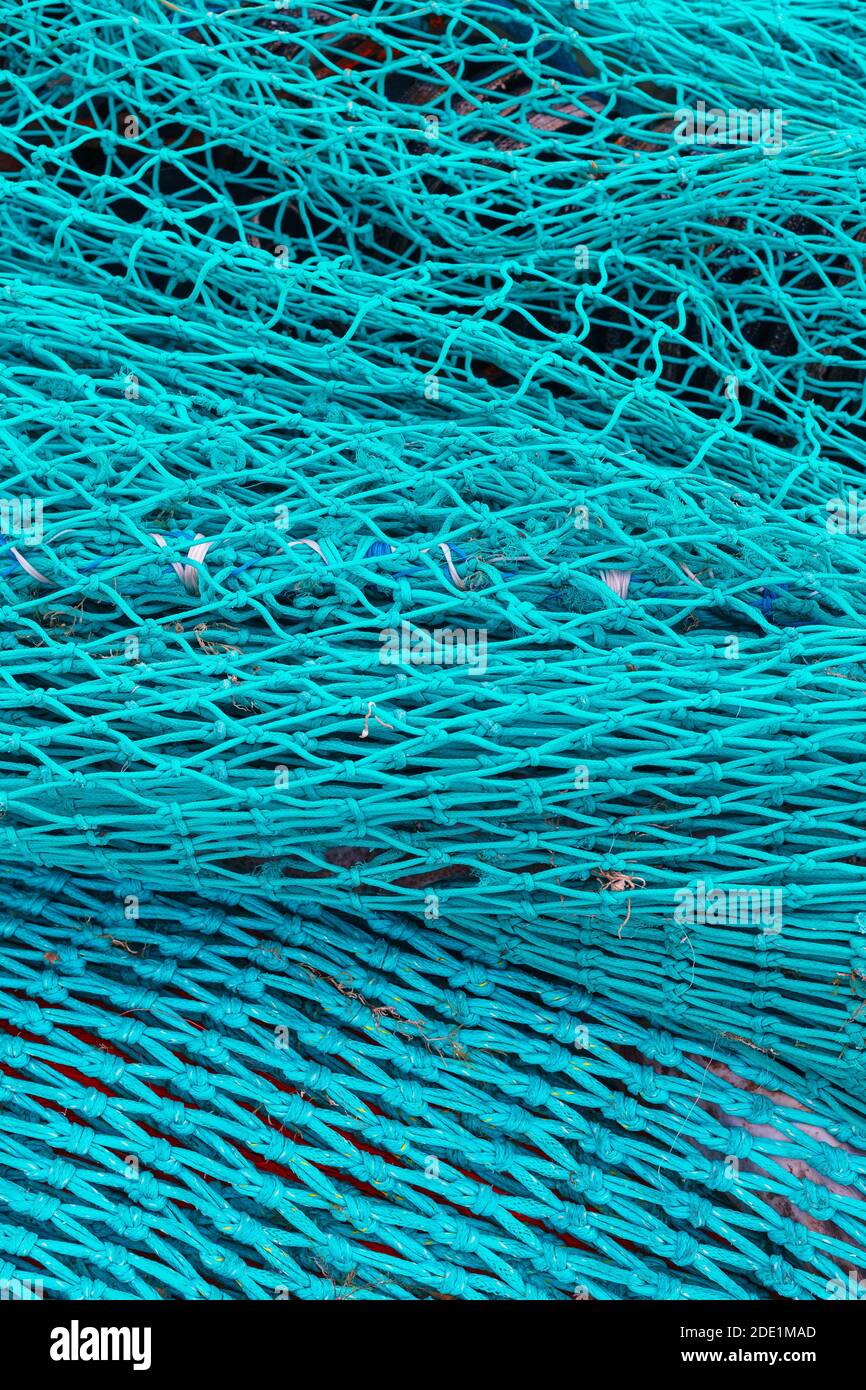 turquoise blue fishing net Stock Photo - Alamy