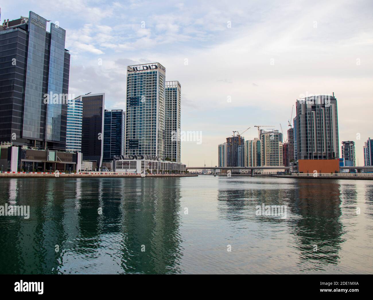 Modern buildings along the Dubai water canal, business bay district UAE ...