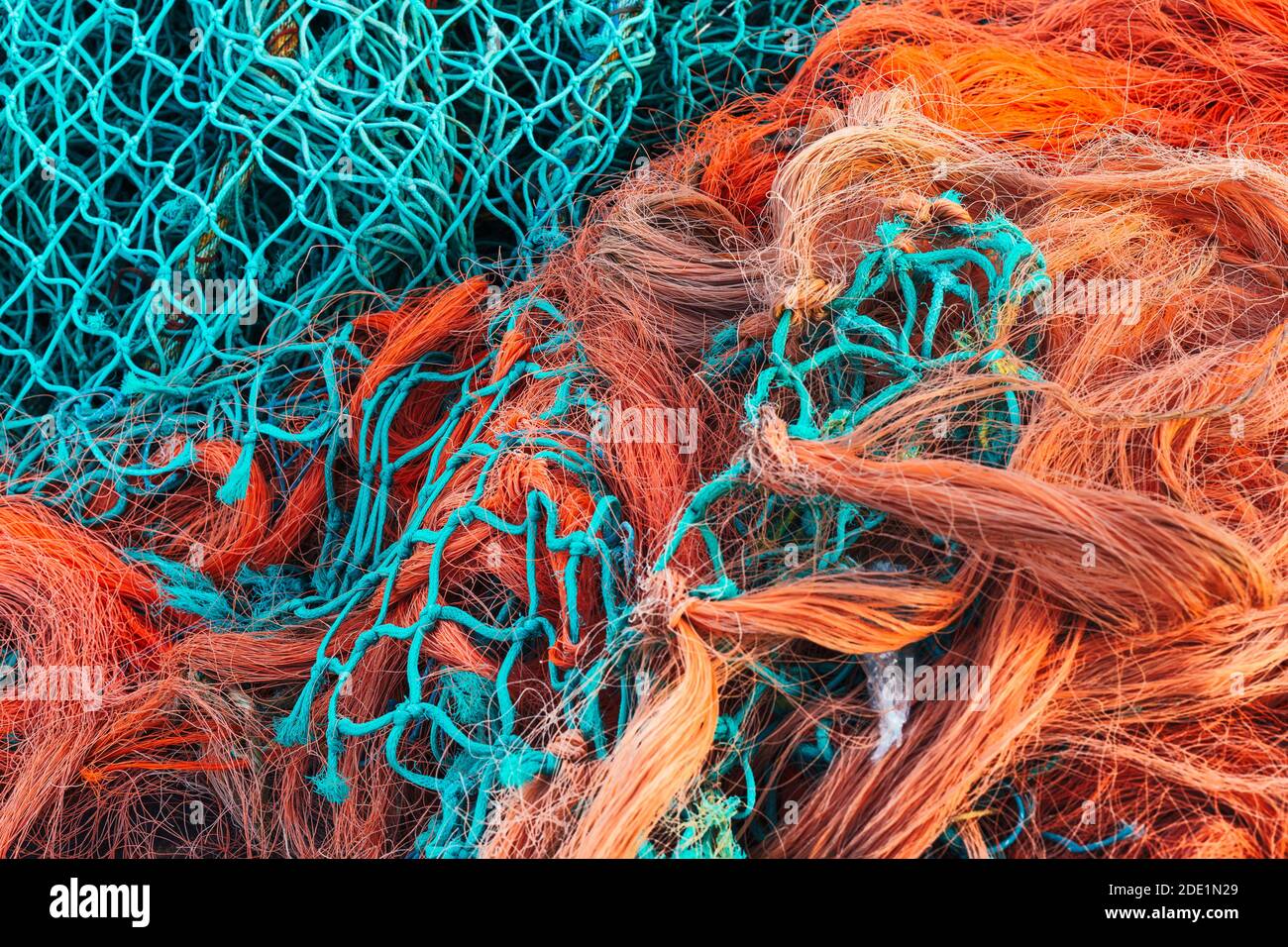 Turquoise blue and orange fishing net Stock Photo - Alamy