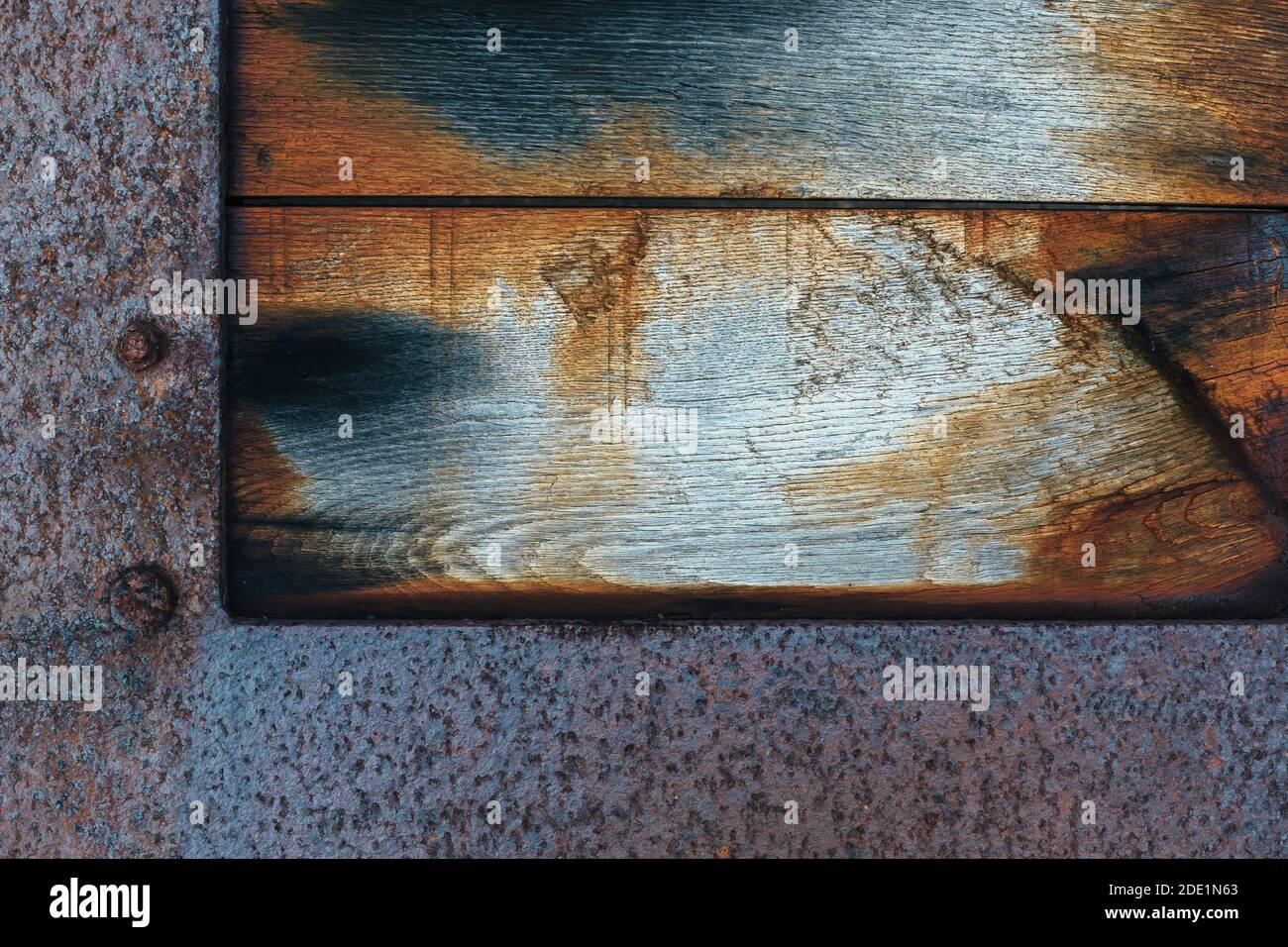 Old rusty wood panel with blue and orange colors with metal frame Stock ...