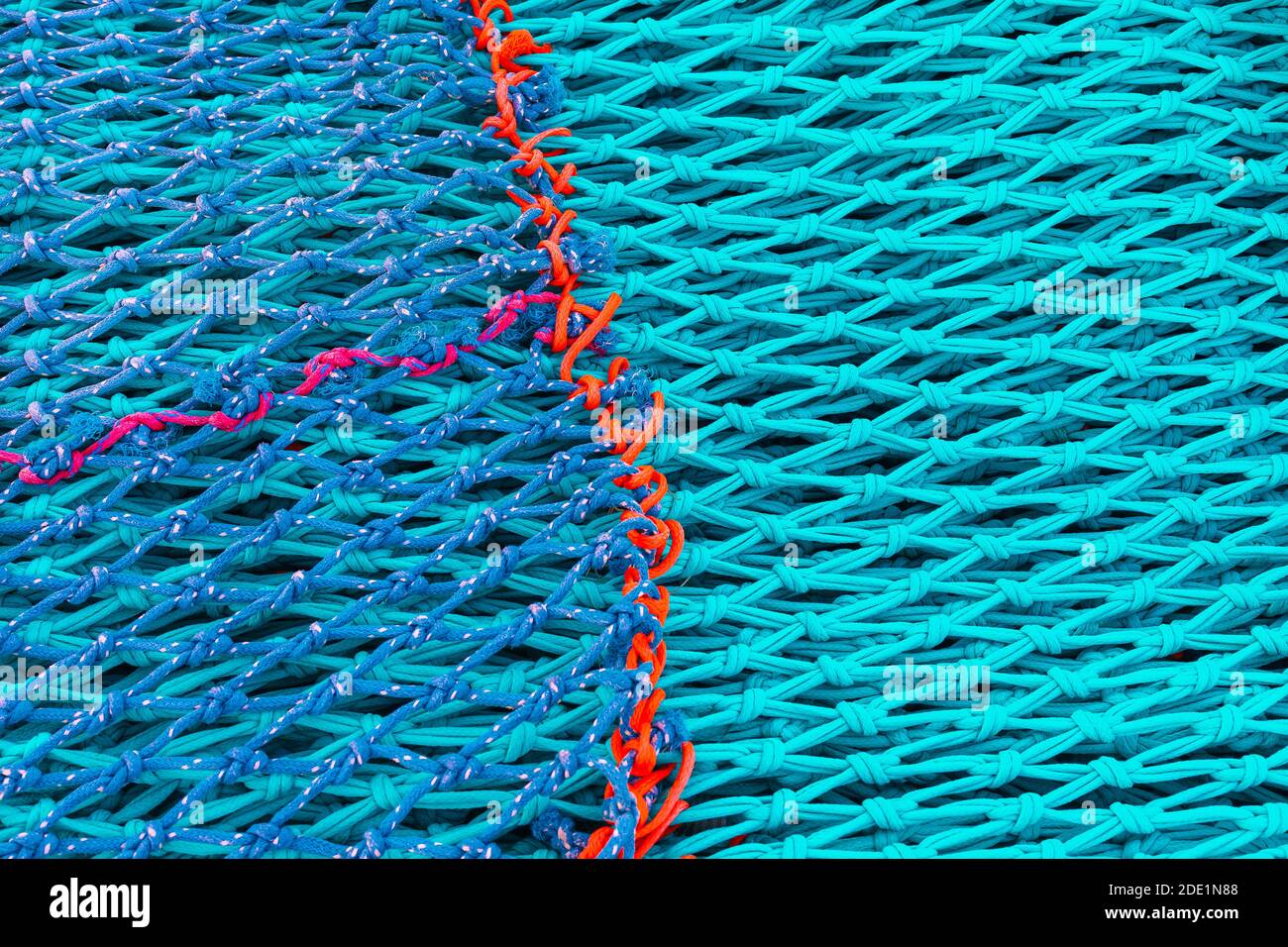 turquoise blue fishing net Stock Photo - Alamy