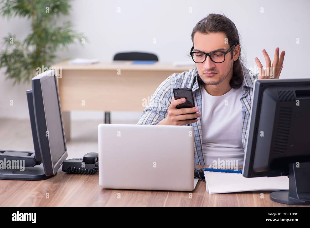 Male it specialist working in the office Stock Photo - Alamy