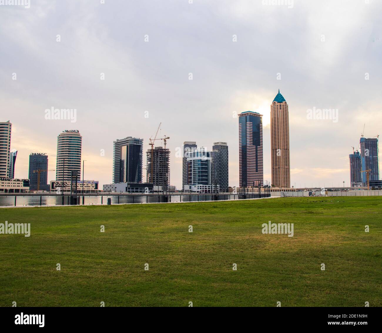Modern buildings along the Dubai water canal, business bay district UAE ...