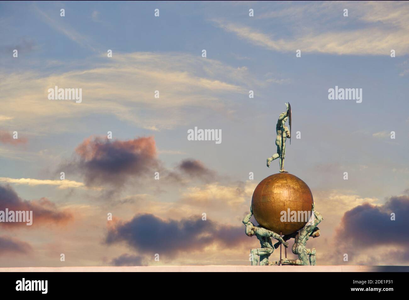 Sculptures of two Atlas figures with a golden globe, and the bronze ...