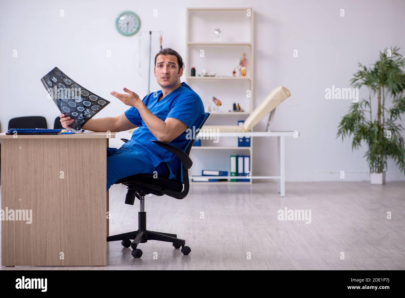 Young doctor radiologist being unhappy after night shift Stock Photo ...