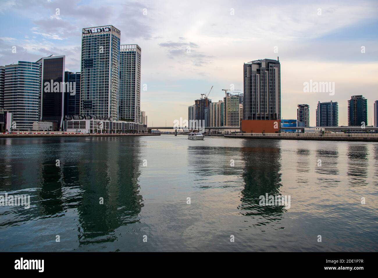 Modern buildings along the Dubai water canal, business bay district UAE ...