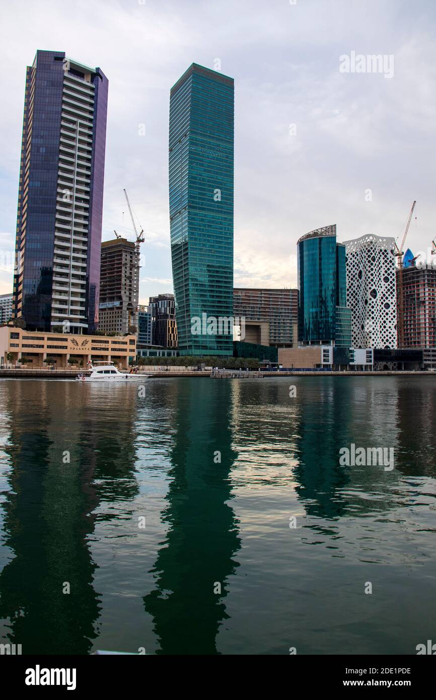 Modern buildings along the Dubai water canal, business bay district UAE ...