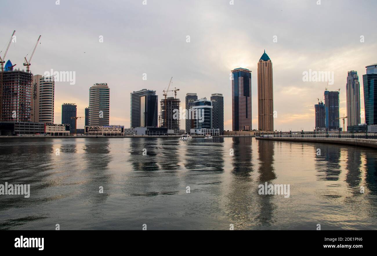 Modern buildings along the Dubai water canal, business bay district UAE ...