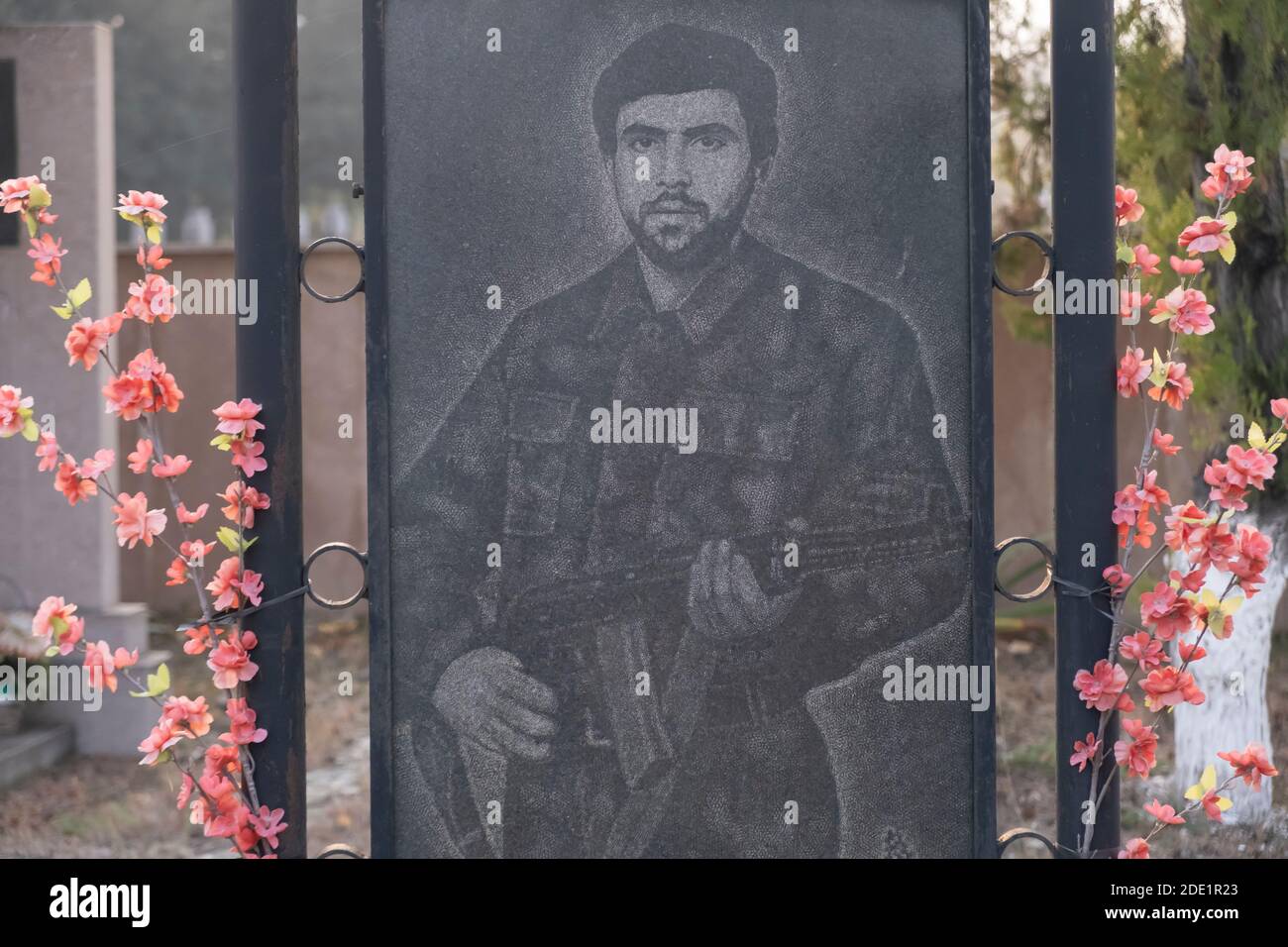 An etched headstone marks the grave of a soldier of the Artsakh Defence ...