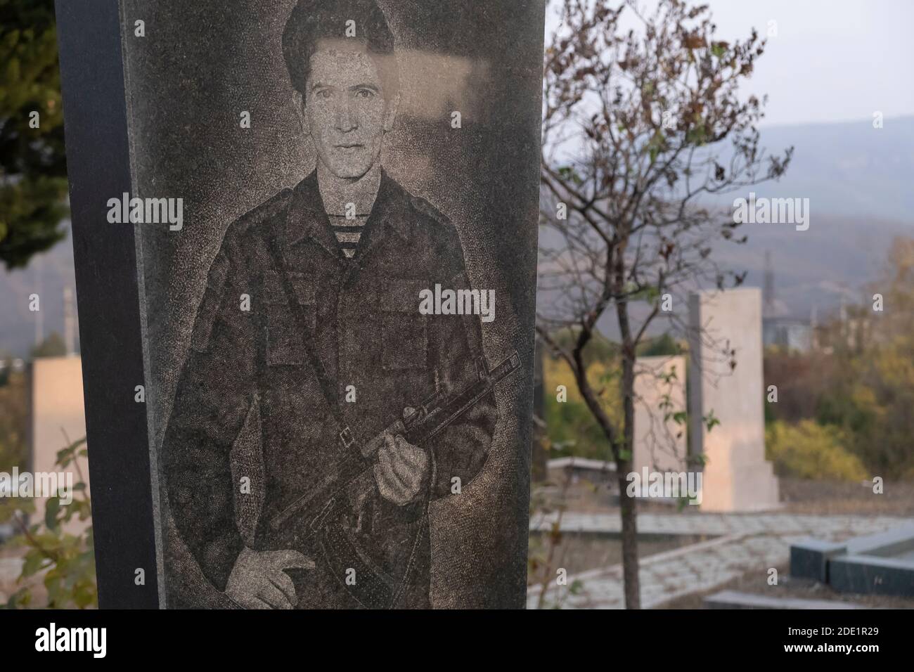 An etched headstone marks the grave of a soldier of the Artsakh Defence ...