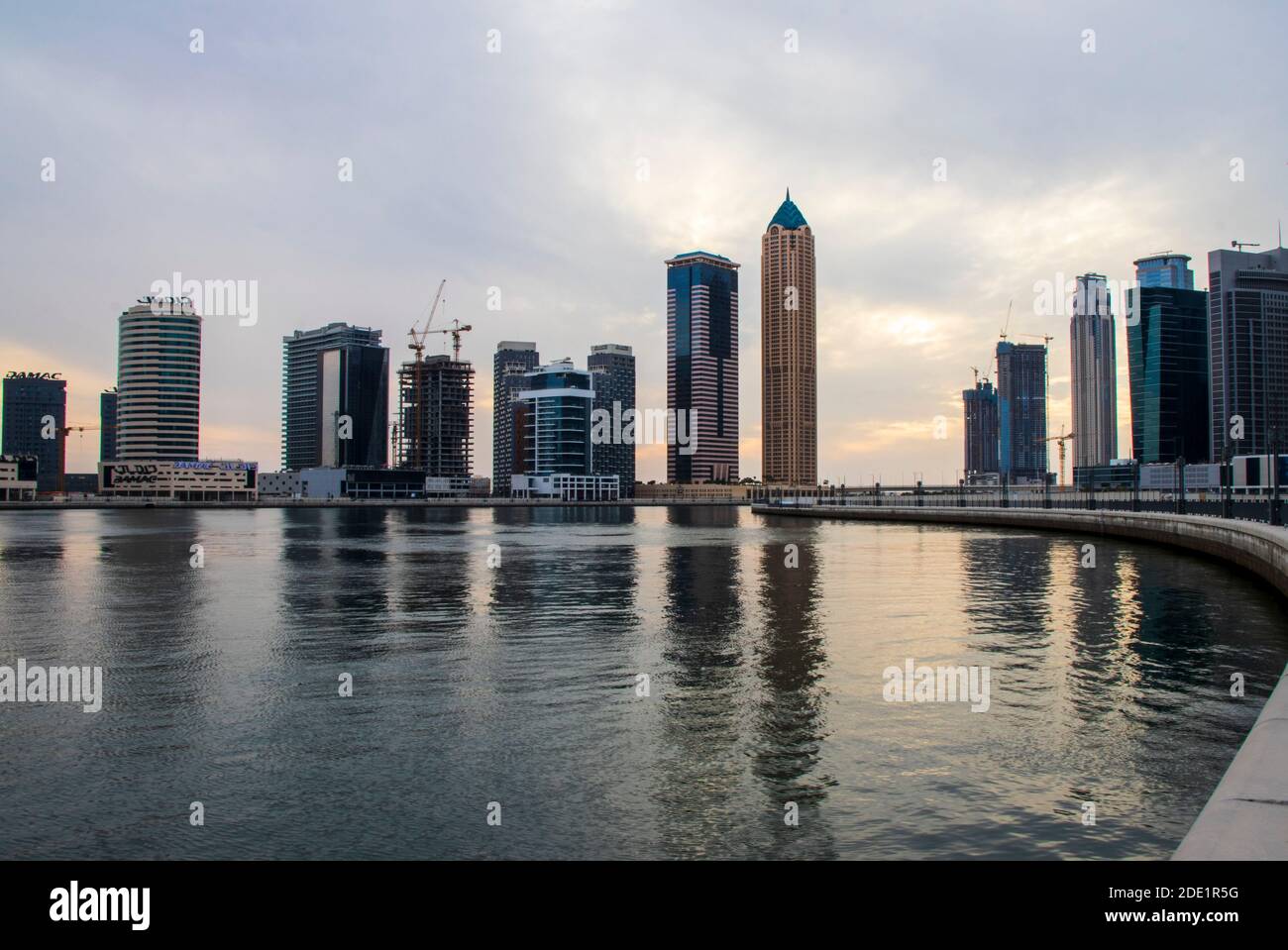 Modern buildings along the Dubai water canal, business bay district UAE ...
