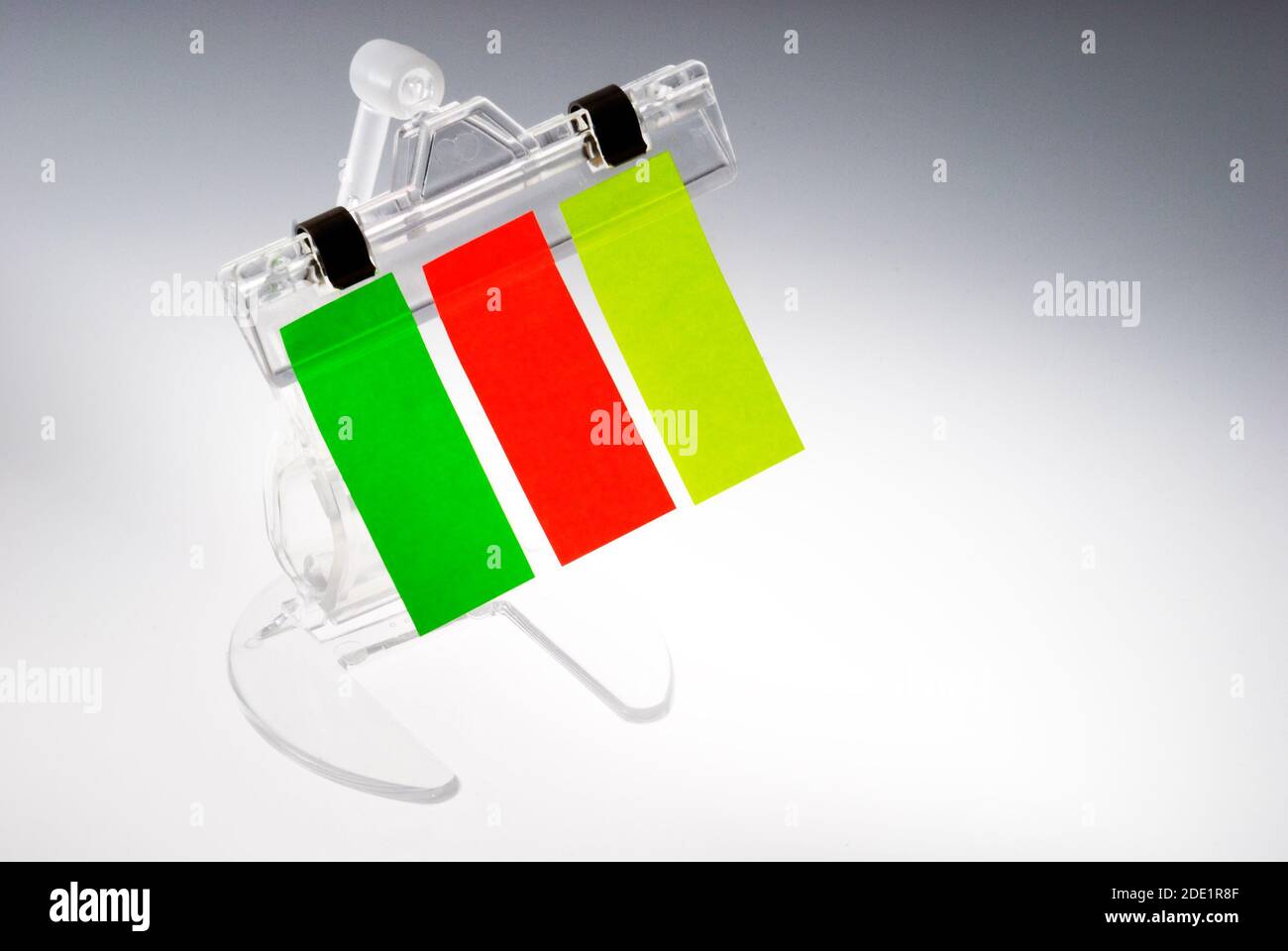 Red, green and yellow stickers in transparent holder Stock Photo - Alamy