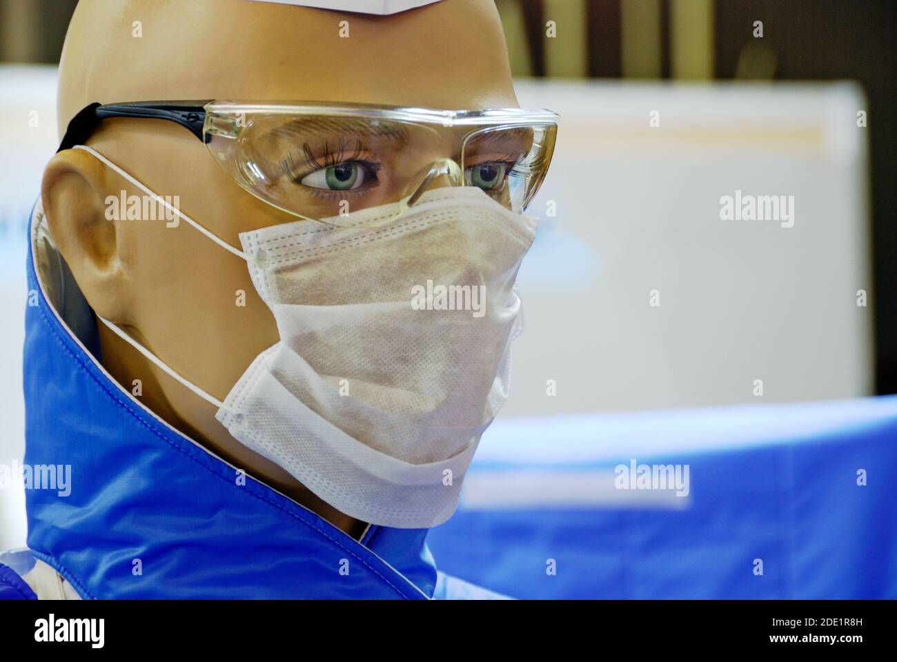 dummy's face with protection mask and security glasses. Samples of ...