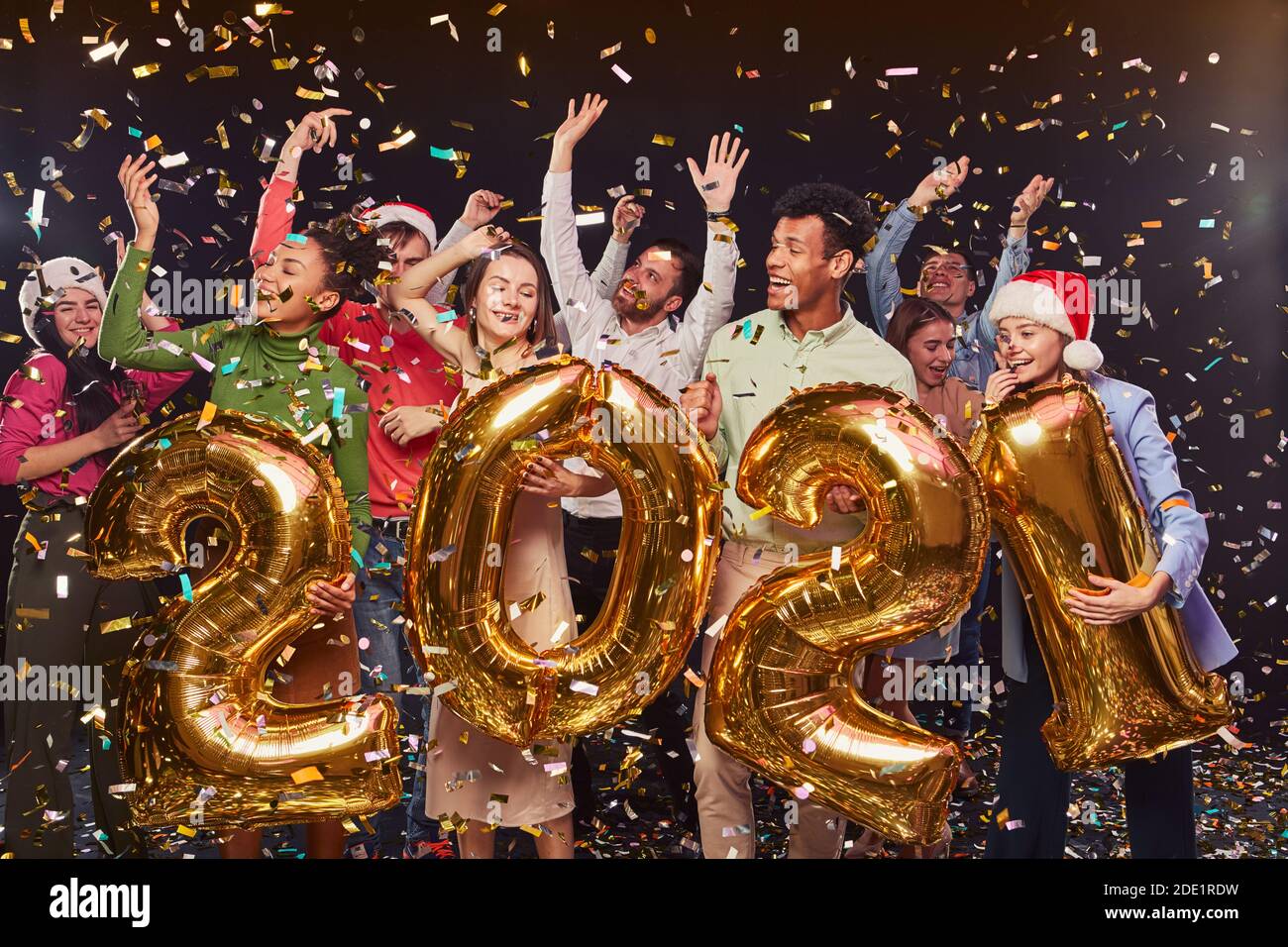 New Years Eve celebration. Group of young happy multiracial people ...