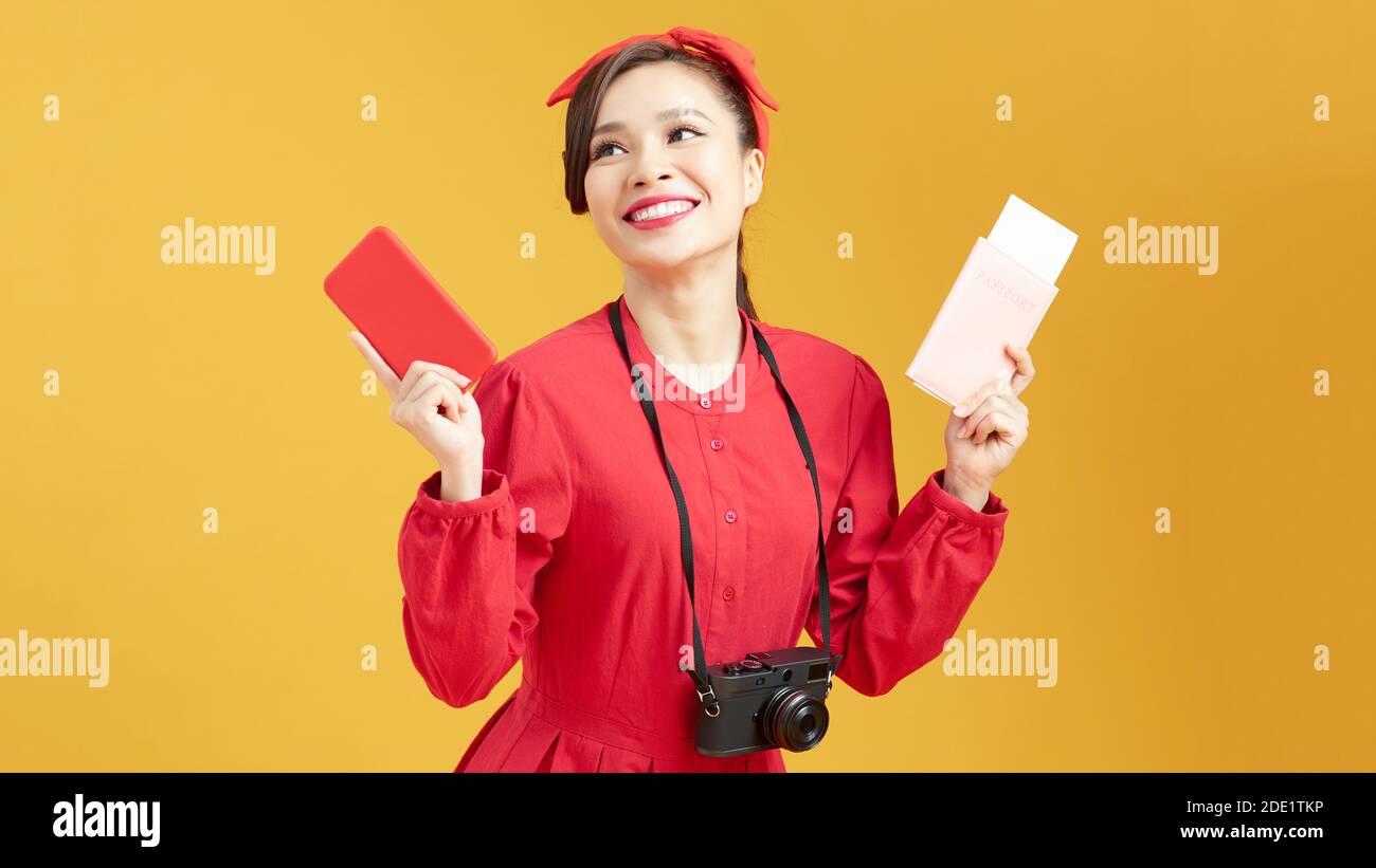 Image of successful voyage girl 20s expressing delight while holding ...