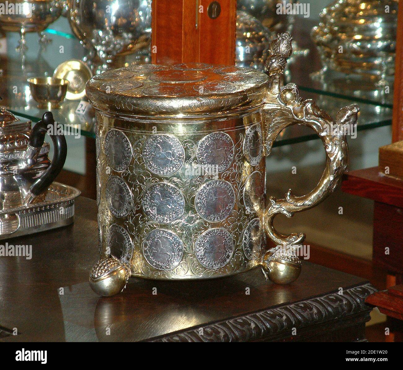 Silver mug on the table. Jewelry made of precious metals Stock Photo ...