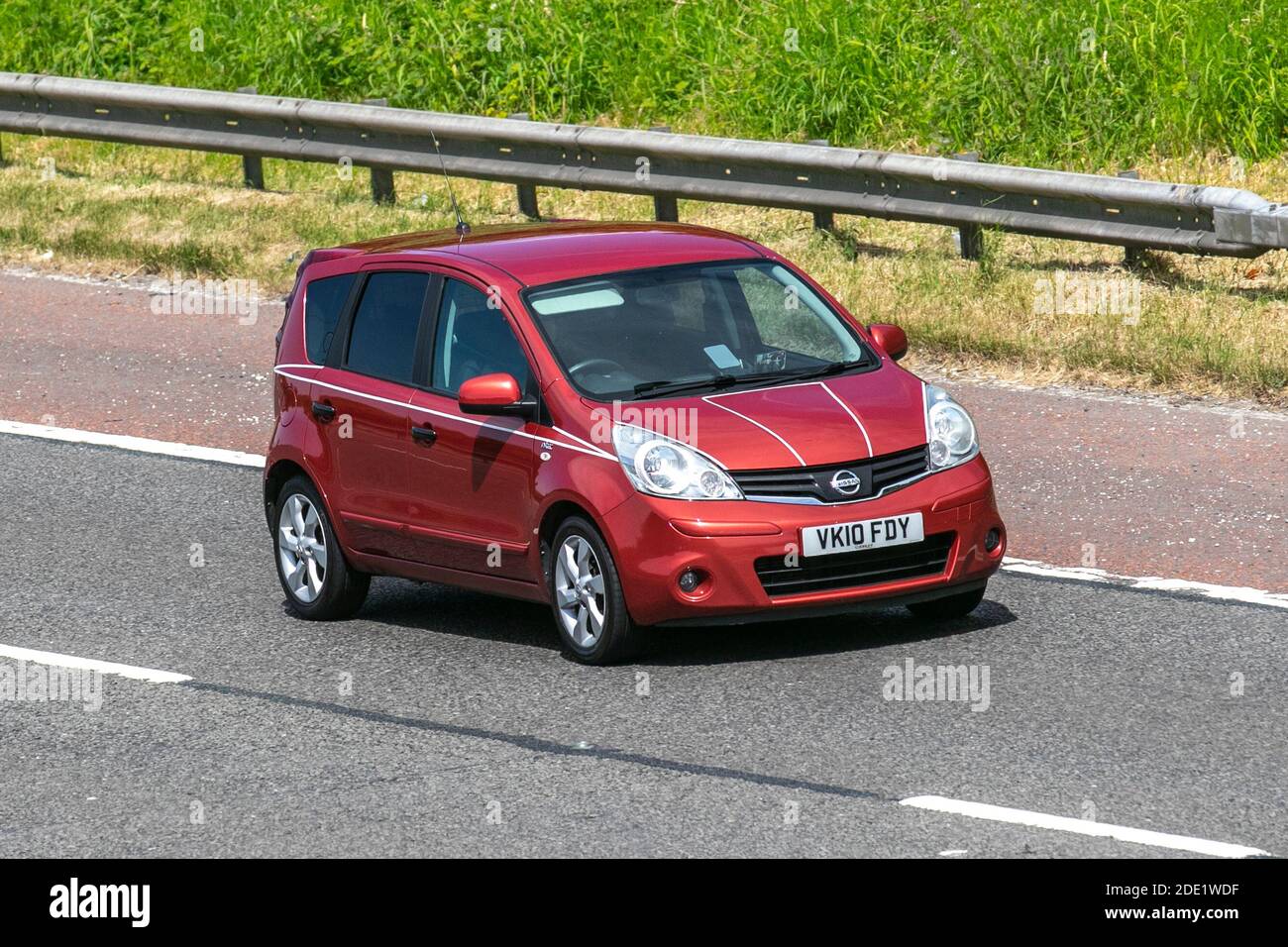 2010 red Nissan Note N-TEC DCI; Vehicular traffic, moving vehicles ...