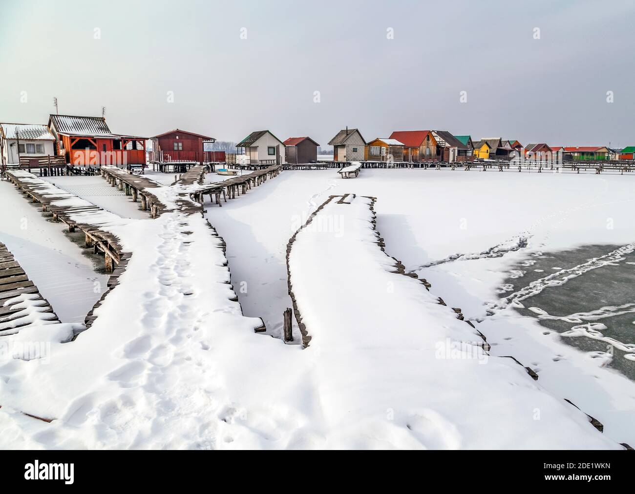 View of the famous floating village at wintertime.Frozen lake, snowy ...