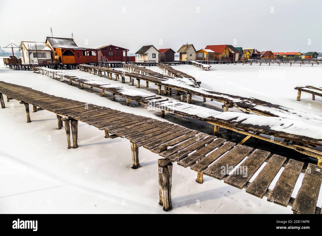 View of the famous floating village at wintertime.Frozen lake, snowy ...