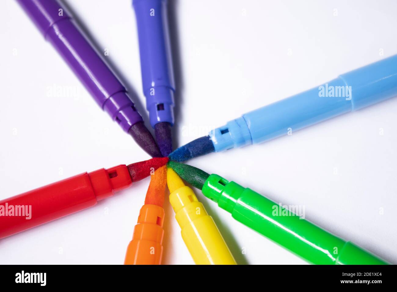 a bunch of colored markers laid out in rainbow order. stationery ...