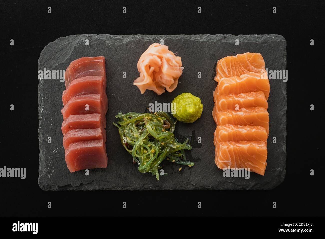 A top view of assorted Japanese sashimi on a board Stock Photo - Alamy