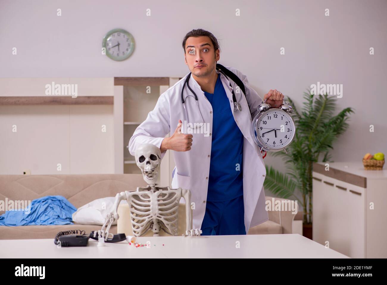 Male paramedic visiting skeleton patient Stock Photo - Alamy
