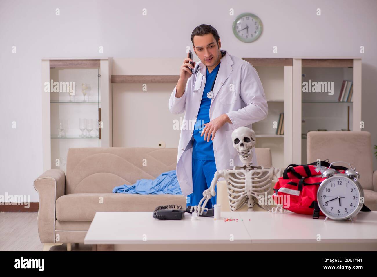 Male paramedic visiting skeleton patient Stock Photo - Alamy
