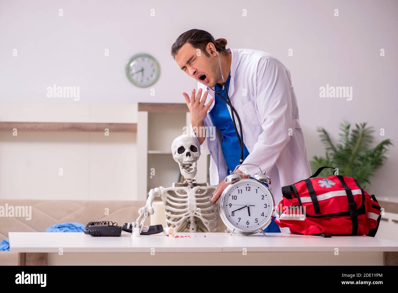 Male paramedic visiting skeleton patient Stock Photo - Alamy