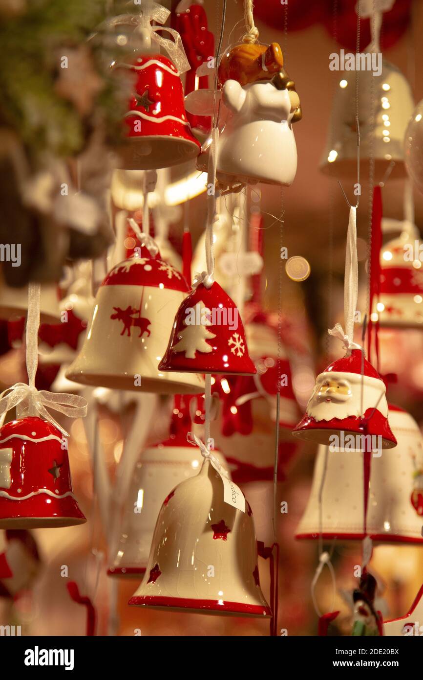 Christmas decorations hanging on a stall in a Christmas market in ...