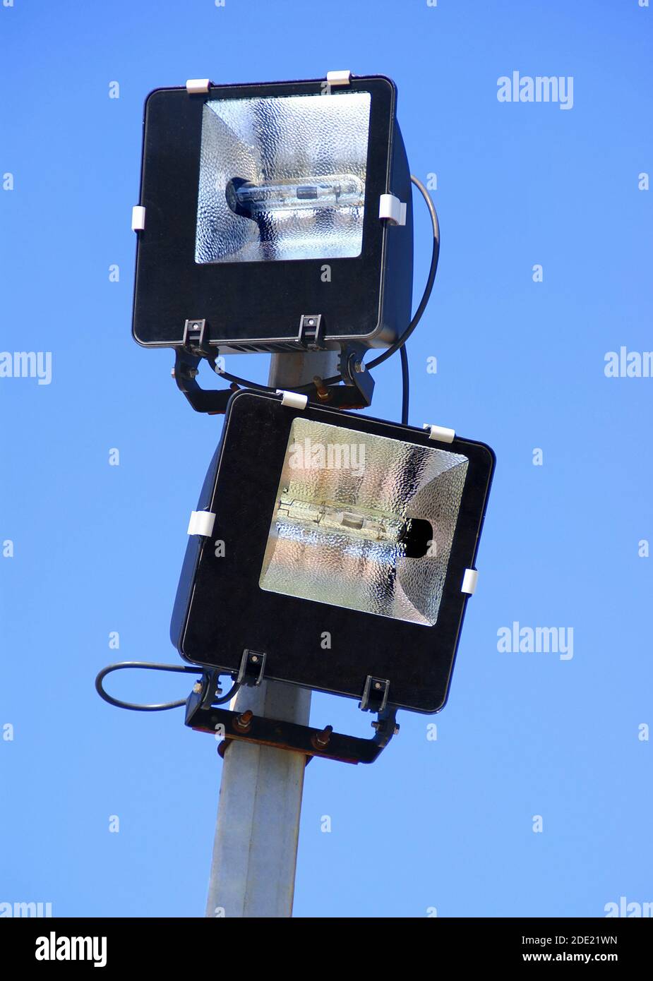 two halogen spotlights set on a mat on blue sky background Stock Photo ...