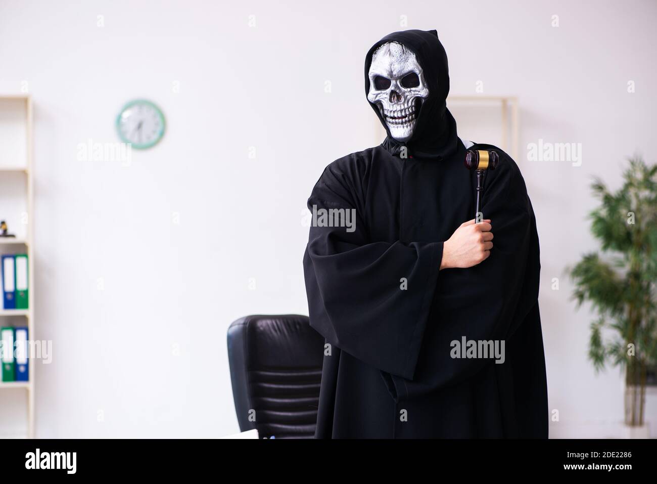 Devil judge working in the courthouse Stock Photo - Alamy