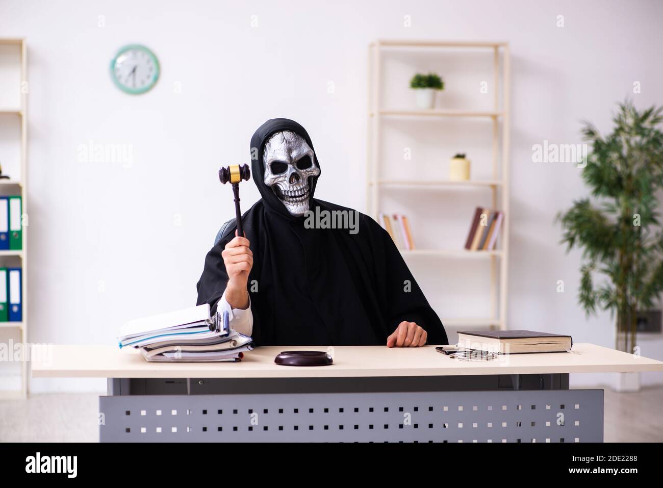 Devil judge working in the courthouse Stock Photo - Alamy