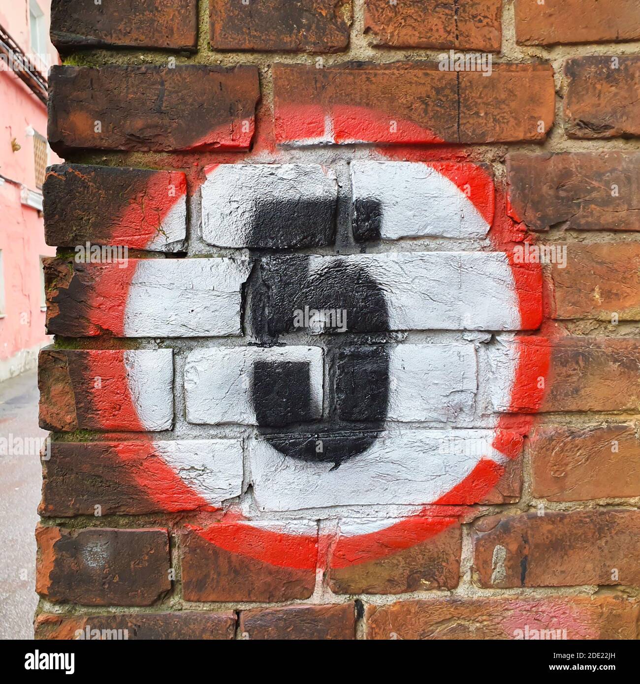 painted on brick wall Road sign to limit the speed to 5 km / h Stock ...