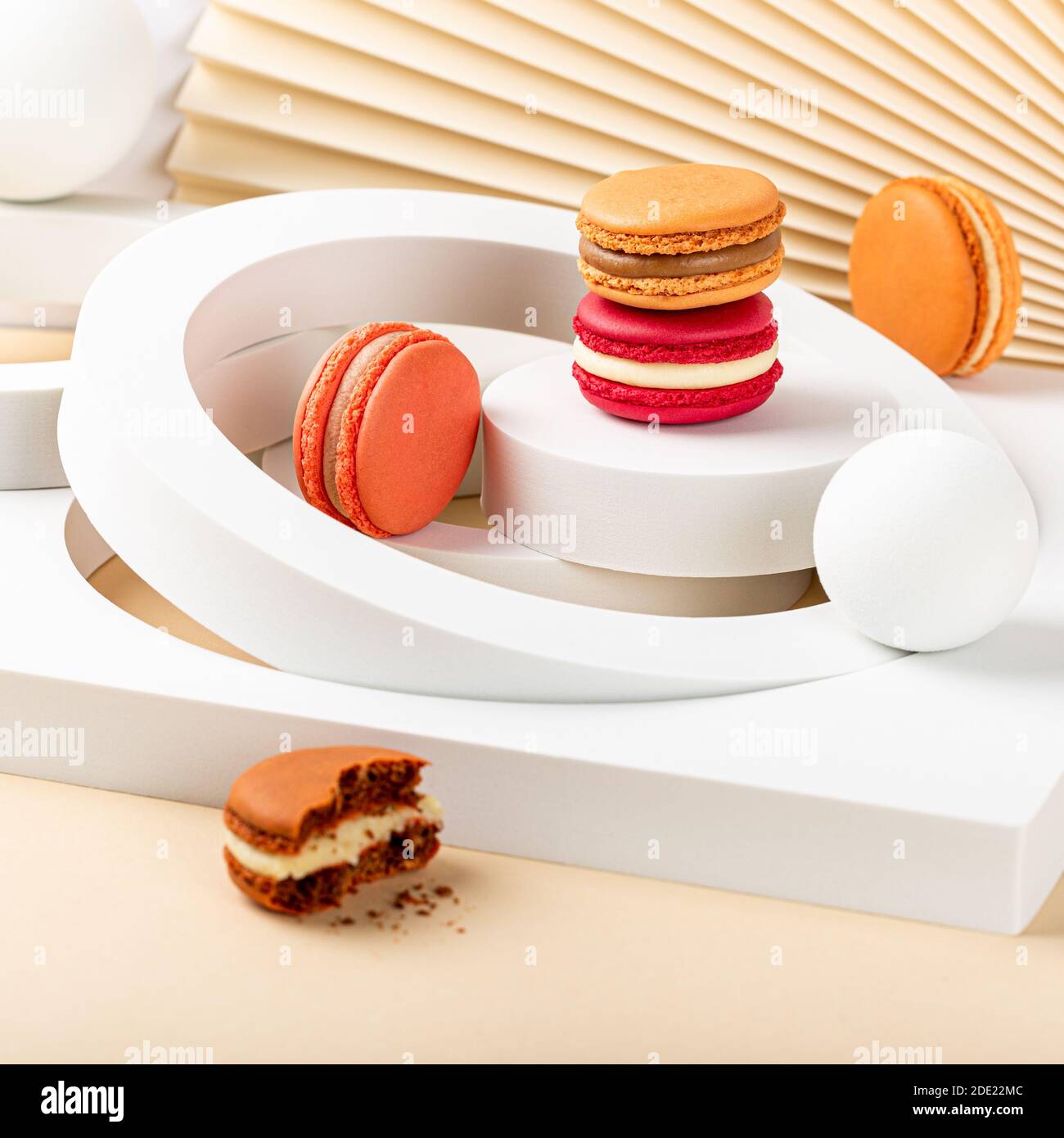 Cake macaron or macaroon on beige background Stock Photo - Alamy