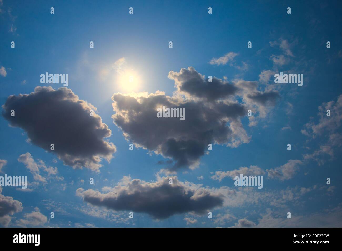 The sky with beautiful fluffy clouds, behind which the sun hid Stock ...