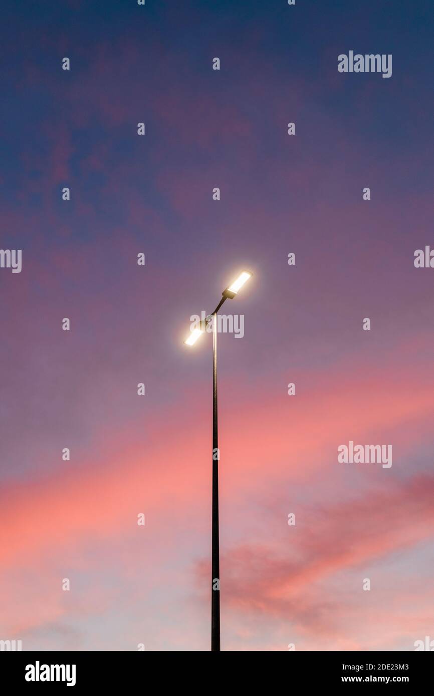 View of the streetlight in a beautiful sunset sky Stock Photo - Alamy
