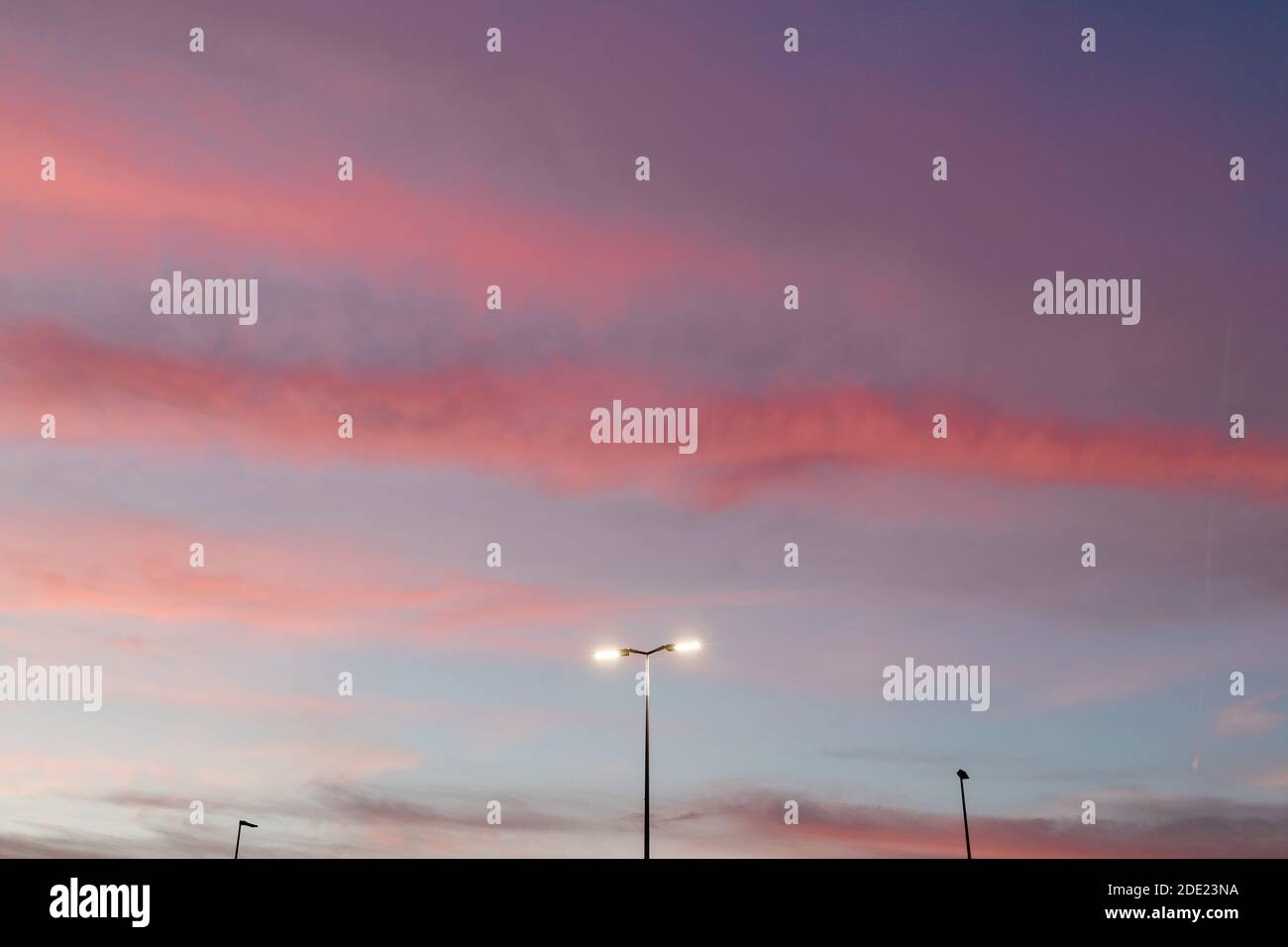 View of the streetlight in a beautiful sunset sky Stock Photo - Alamy