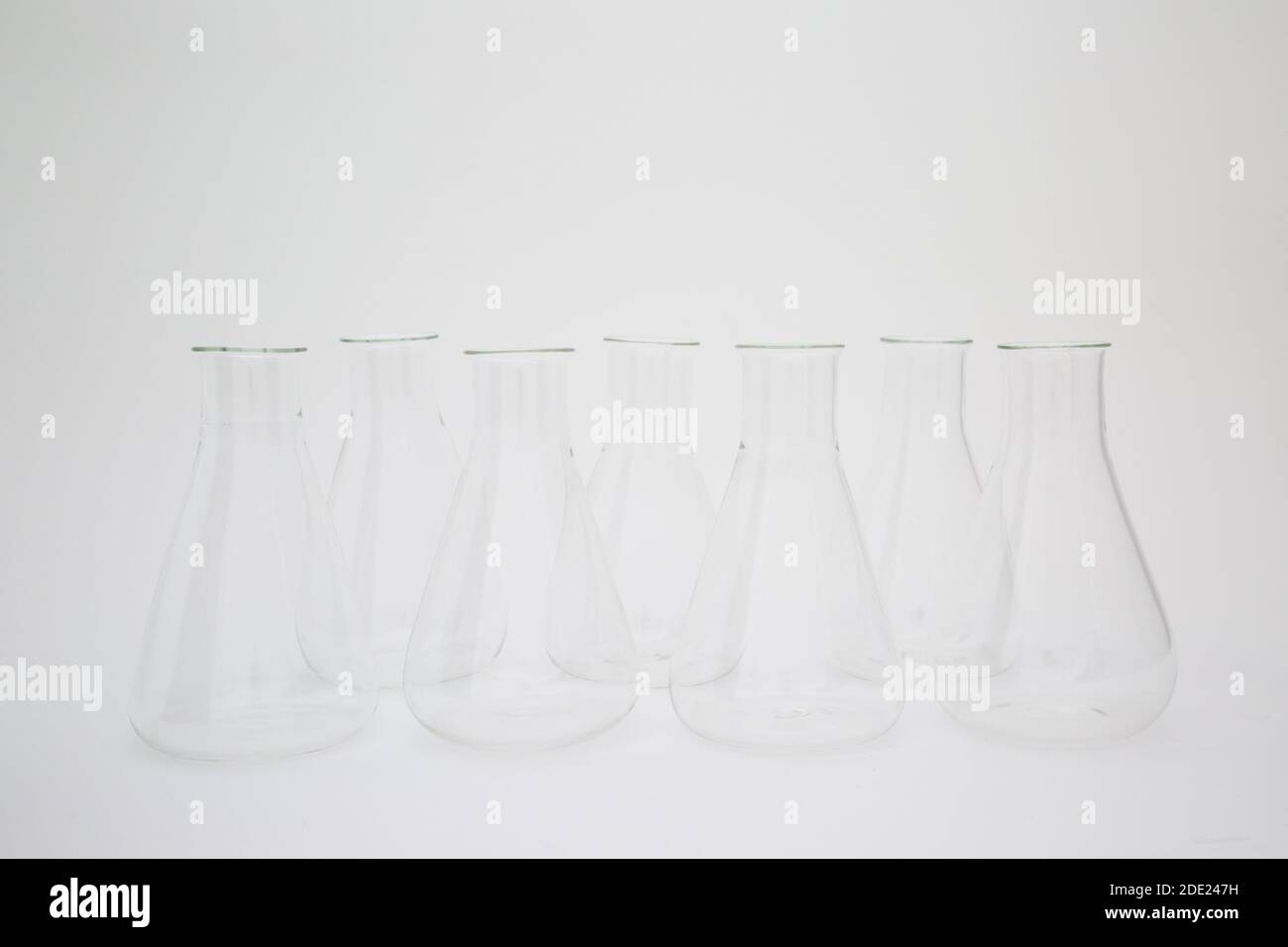 Group of scientific laboratory glass erlenmeyer flask isolated on white ...