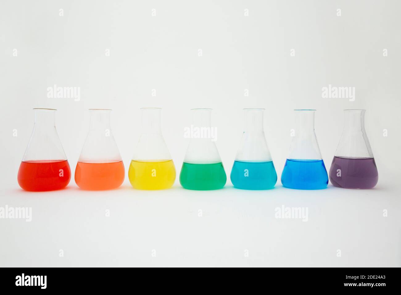 Scientific laboratory glass erlenmeyer flask filled with colorful ...
