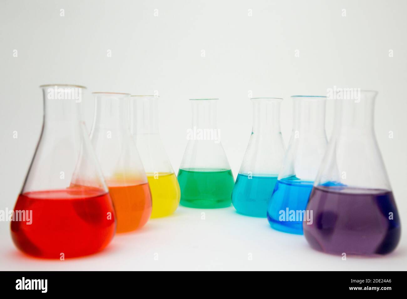 Scientific laboratory glass erlenmeyer flask filled with colorful ...