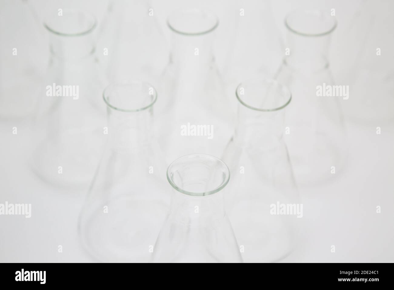 Group of scientific laboratory glass erlenmeyer flask isolated on white ...